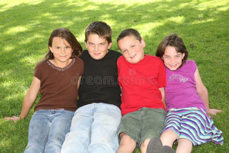 Four Happy Children stock photo. Image of laying, group - 2240820 Four Happy Children stock photo. Image of laying, group - 2240820