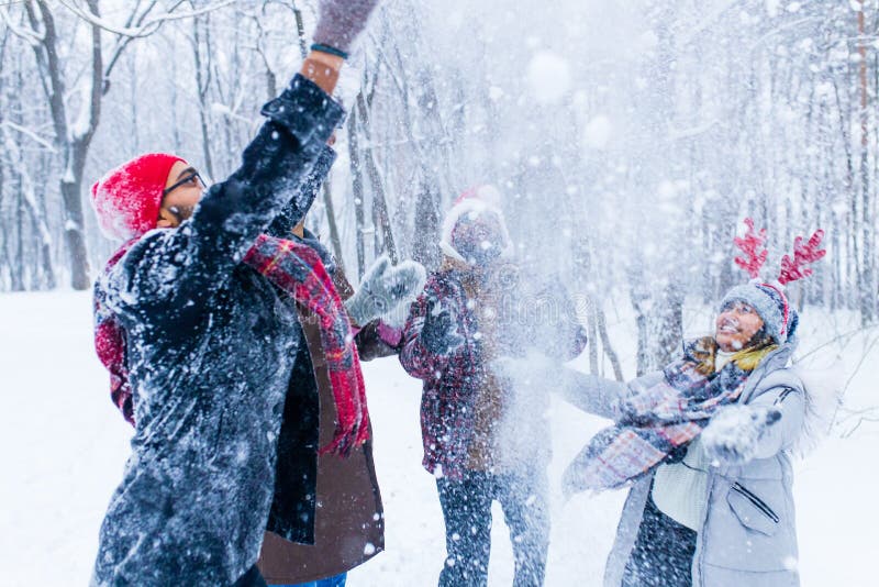 Four Happy Friends are Having Fun and Throwing Snow Stock Photo - Image ...