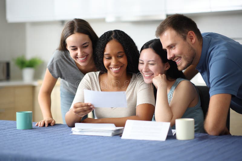 Four Happy Interracial Roommates Checking Bank Statement Stock Photo ...