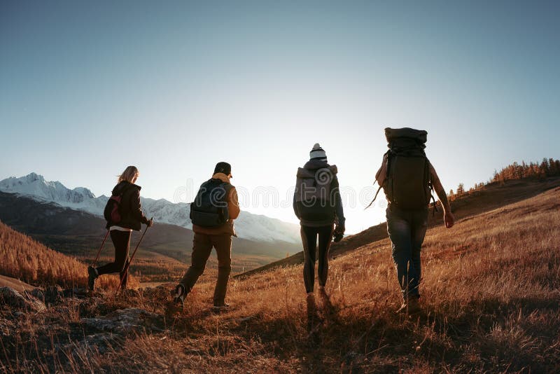 Five Hikers Going Uphill at Sunset Stock Image - Image of hiker ...
