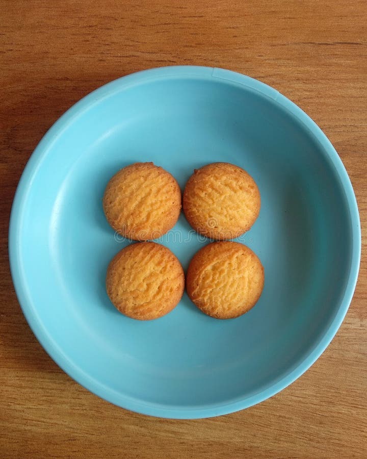 Four Homemade Biscuits on a Blue Plastic Plate. Stock Photo - Image of ...