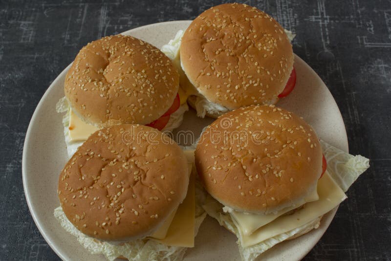 Four Homemade Burgers on a Plate Top View Stock Image - Image of ...