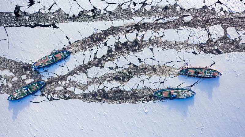 Four Icebreakers Crushing Ice on River. Aerial View of Winter Stock ...