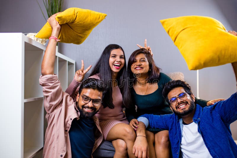 Four Indian Friends Fighting Pillows at Home Stock Photo - Image of ...
