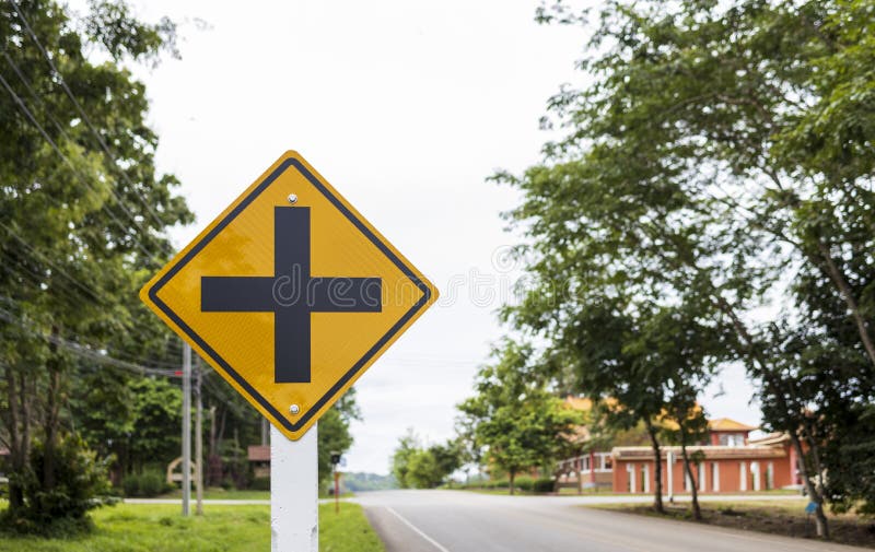 Four Intersection Yellow Traffic Sign Stock Photo - Image of merges ...