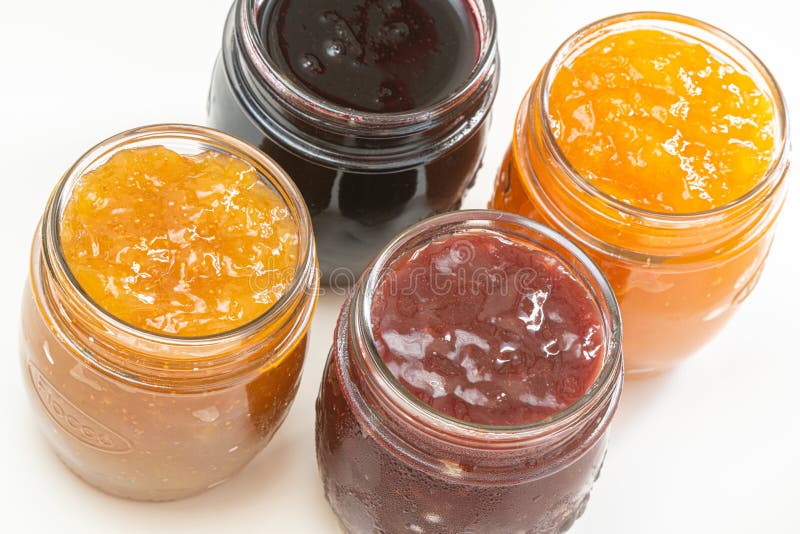 Four Jars of Jam on Wooden Table Stock Image - Image of juicy ...