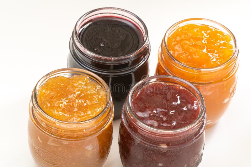 Four Jars of Jam on Wooden Table Stock Image - Image of juicy ...