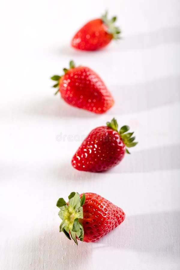Four Juicy Strawberry on the Table Stock Photo - Image of fruit, juicy ...