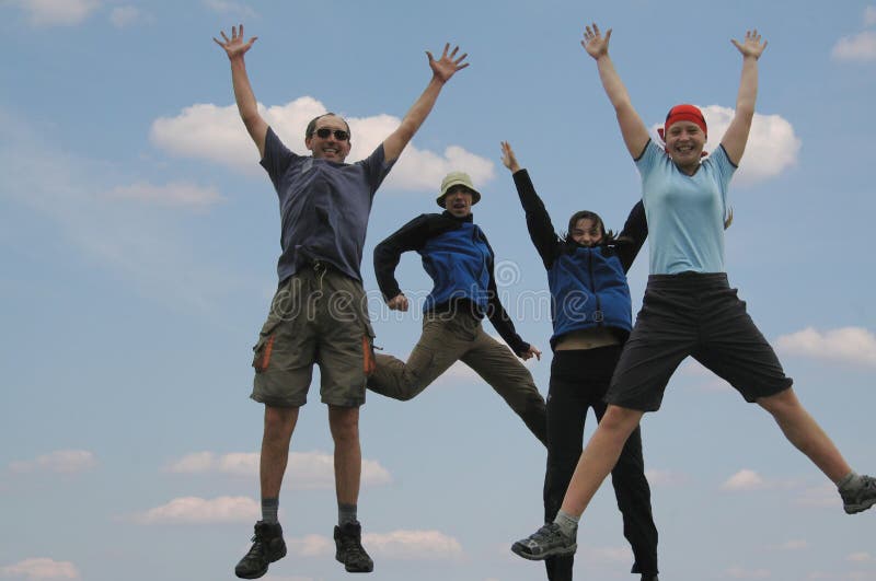 Four hippies jumping up stock image. Image of exhilarated - 3377421