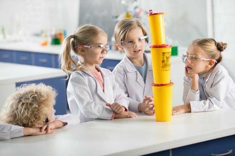 Four Kids in Science Laboratory Wearing Lab Coats Stock Photo - Image ...