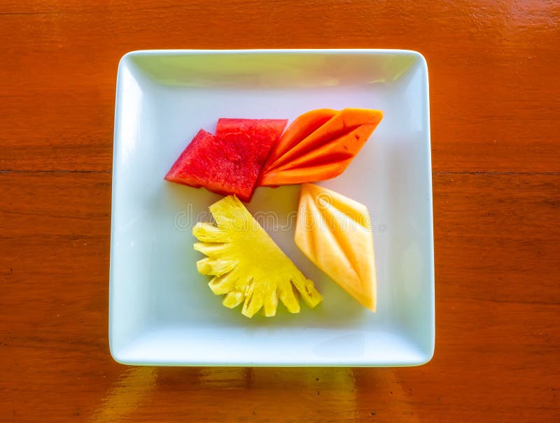 Four Kinds of Fruit on White Dish Stock Image - Image of orange ...