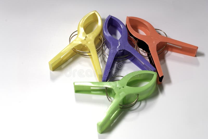 Four Large Cloth Clamps in Various Colors on a White Background. Stock ...