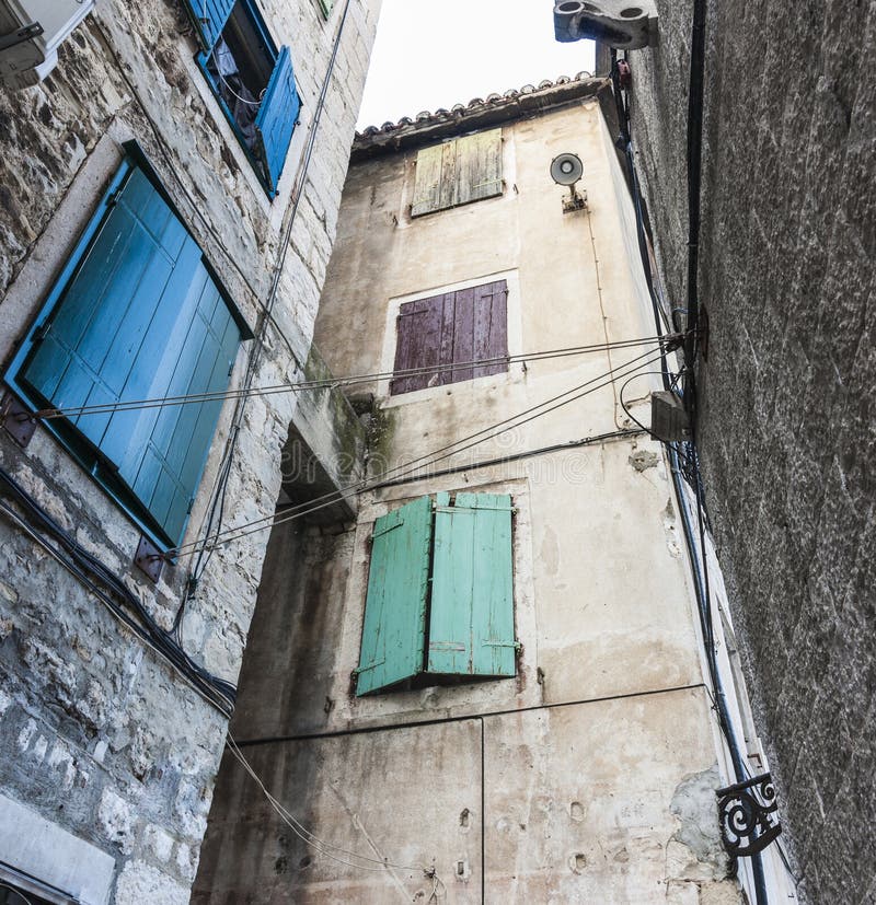 Four Level Apartments Buildings with Coloured Shuttered Windows. in ...
