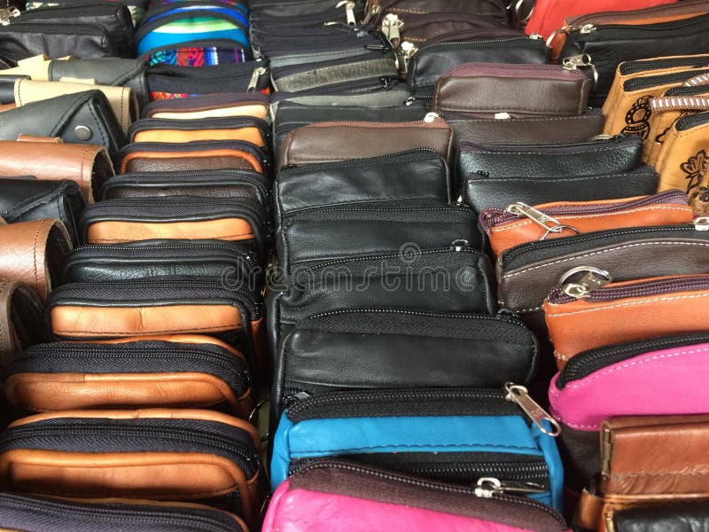 Four Lines with Many Wallets Lined Up at a Display To Be Sold Editorial ...