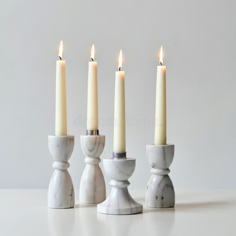 Four Lit Candles Stand in White, Marble-style Holders on a Light ...