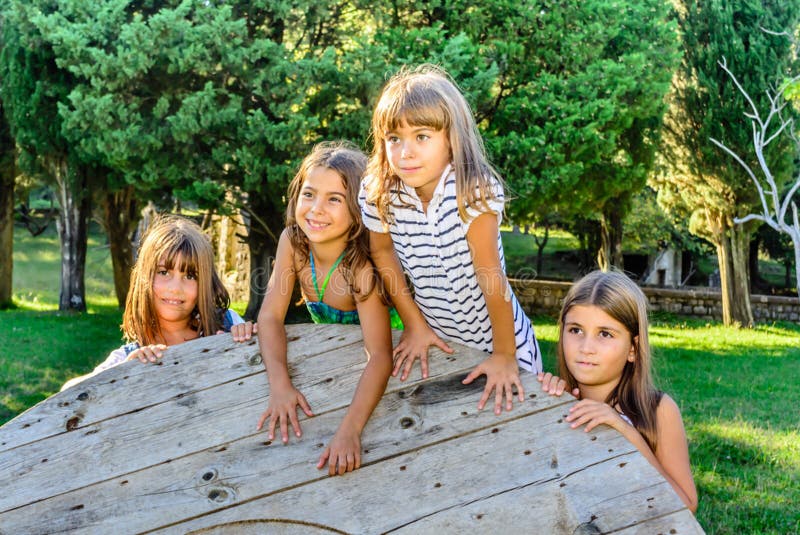 Four Little Girls Playing in the Park Stock Photo - Image of girls ...