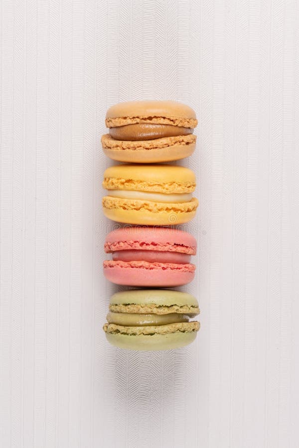 Four Macaroons On White Vinyl Background Stock Image - Image of ...