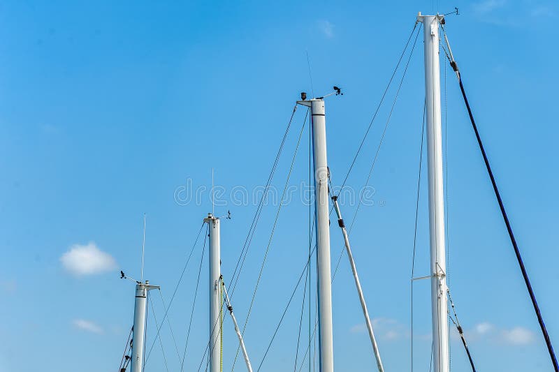 Four Masts of a Sailboat Against the Sky Stock Photo - Image of mast ...