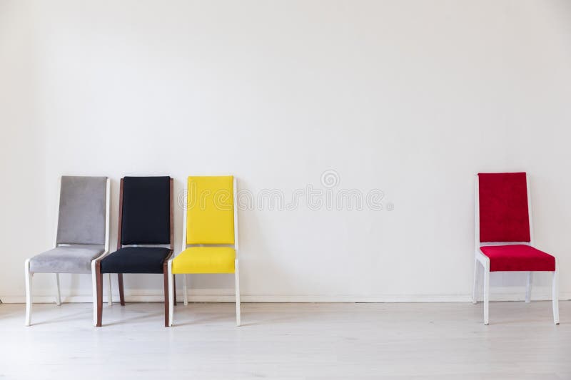 Four Multicolored Chairs in the Interior of an Empty White Room Stock ...