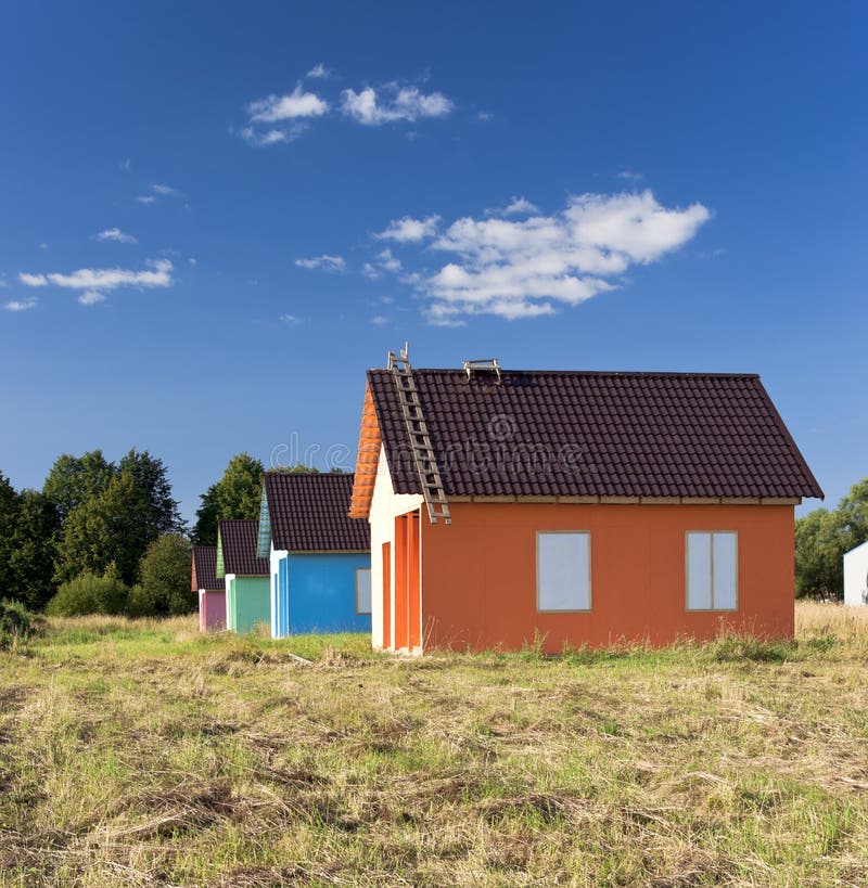 Four multicolored houses stock image. Image of identic - 27822555