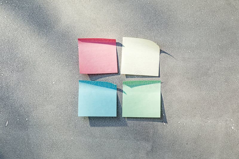 Four Multicolored Sticky Notes in Sunlight on Gray Concrete Texture ...