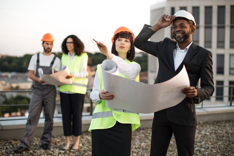 International Engineers Discussing Plan Stock Photos - Free & Royalty ...