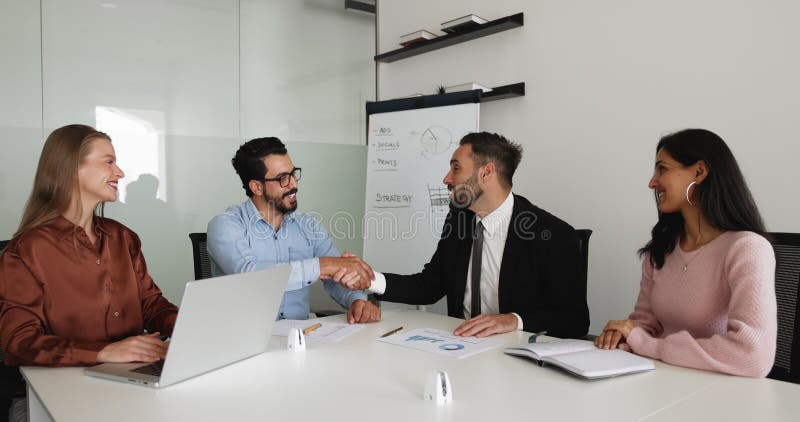 Four Multinational Professional Team Members Shaking Hands Stock Video ...