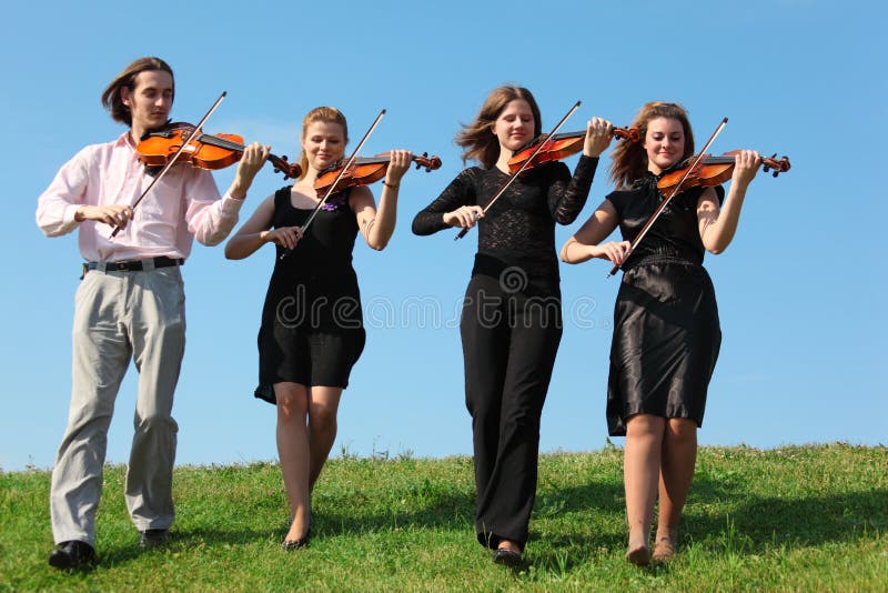 Four Musicians Go and Playing Violins Against Sky Stock Image - Image ...
