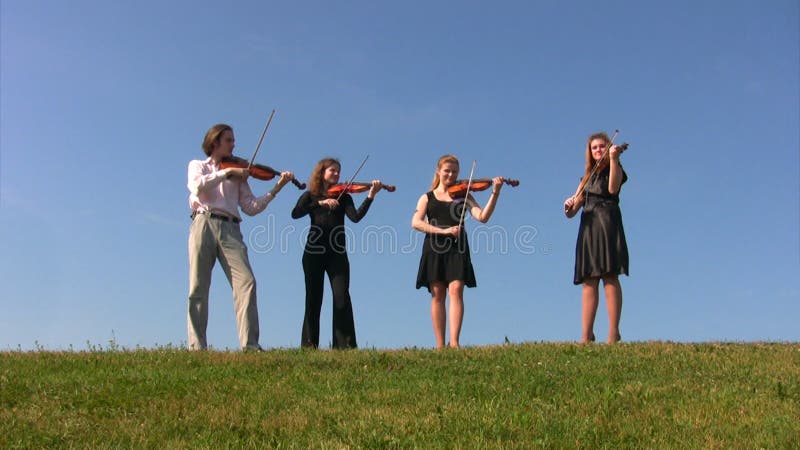 Four Musicians Plays Violins Walks from Behind Stock Video - Video of ...