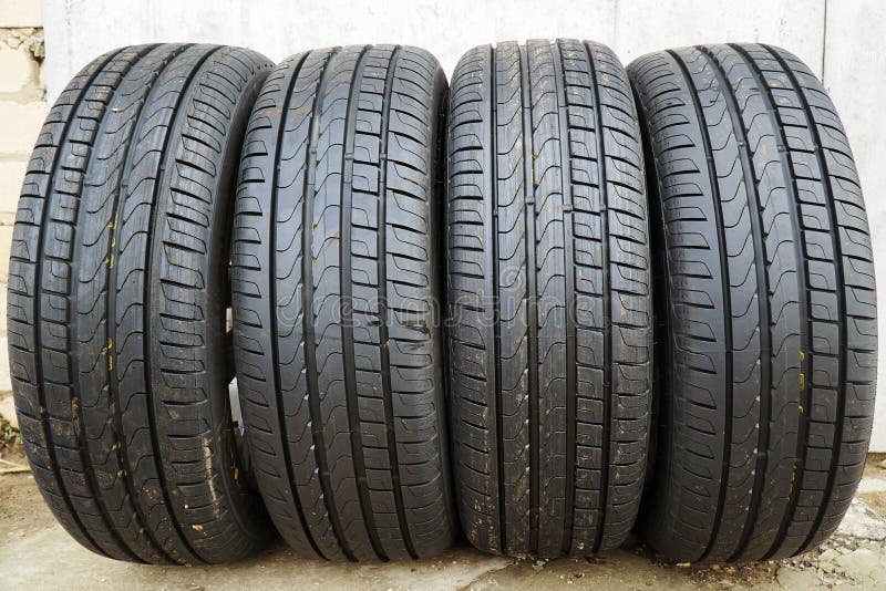 Four new black car tires stock photo. Image of safety - 216765054