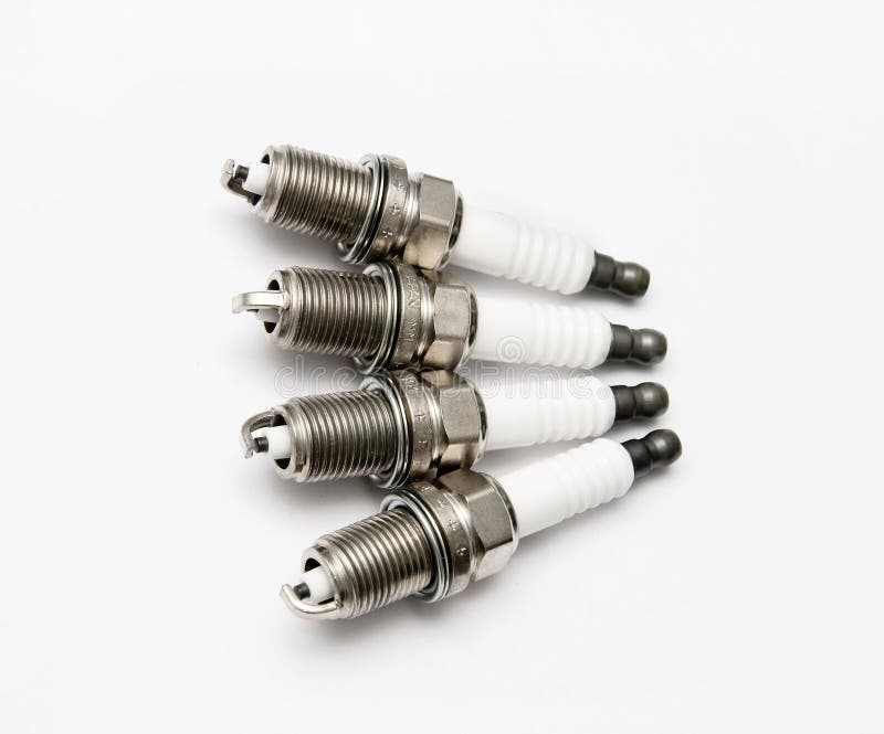 Four new spark plugs stock photo. Image of auto, pump - 25533568