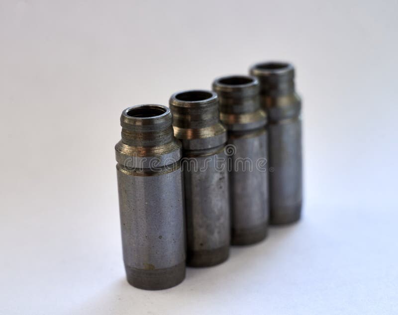 Four New Valve Guides for Engine Stock Photo - Image of machine, shiny ...