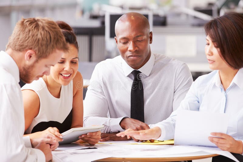 Four Office Colleagues in a Casual Team Meeting Stock Image - Image of ...