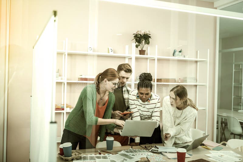 Four Office Workers Feeling Overloaded with a Lot of Work Stock Photo ...