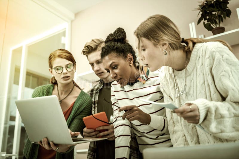 Four Office Workers Working on the Same Project Feeling Busy Stock ...
