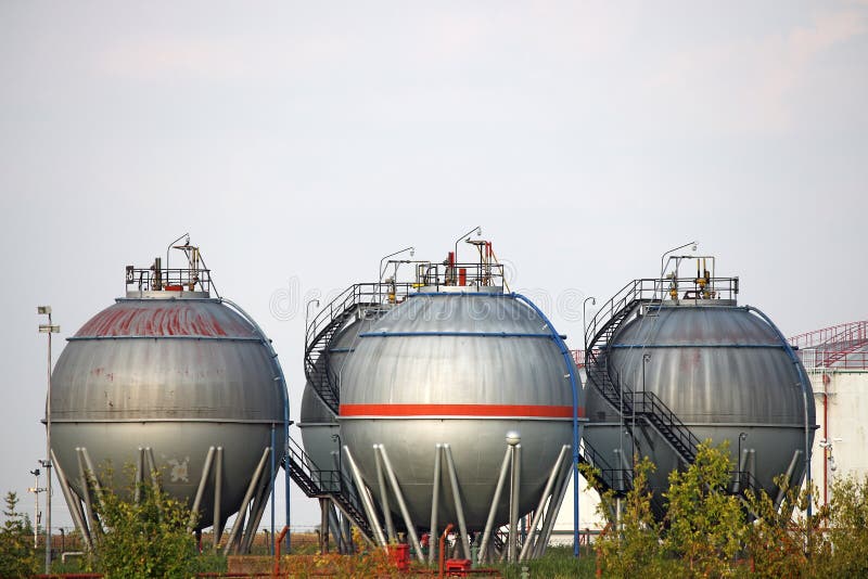 Four oil tanks stock photo. Image of chemical, engineering - 60797778