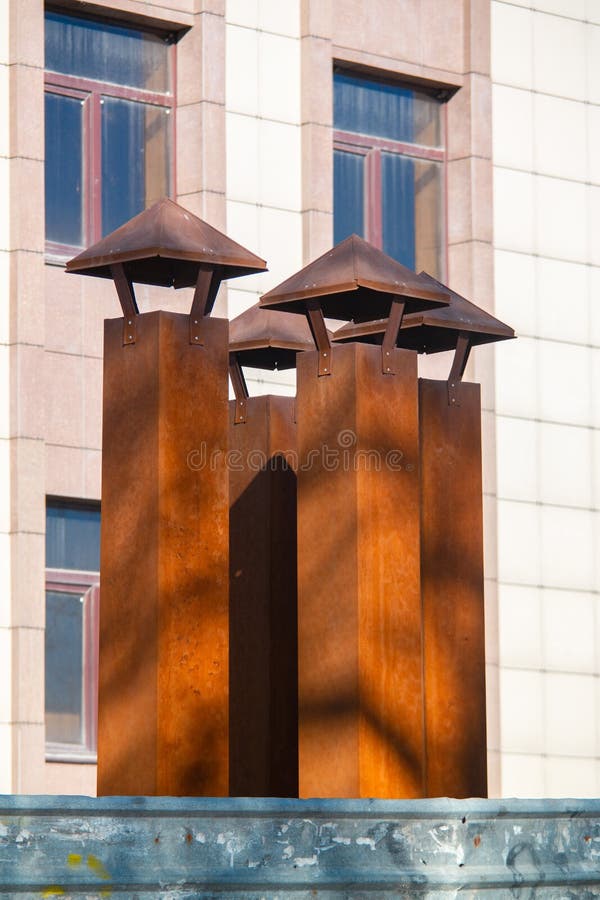 4 Old Rusted Smoke Chimneys on a Roof Stock Photo - Image of brown ...