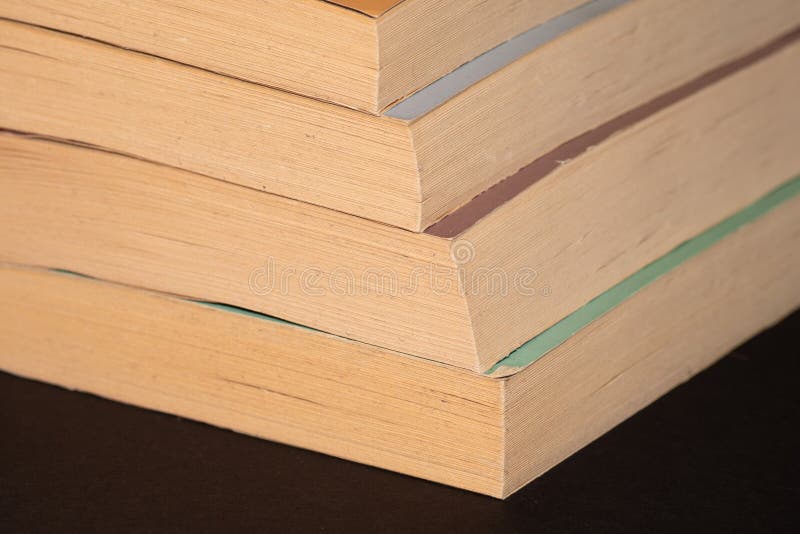 Four Paperback Books on a Black Background Stock Photo - Image of novel ...