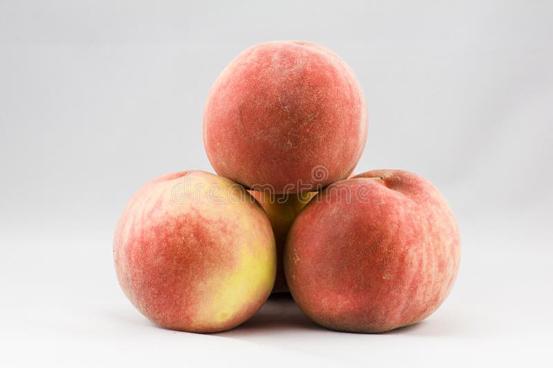 Four Peaches and a Half on a White Background Stock Image - Image of ...