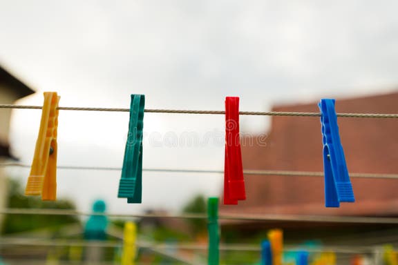 Four Pegs on a String stock photo. Image of brown, clothesline - 97123684