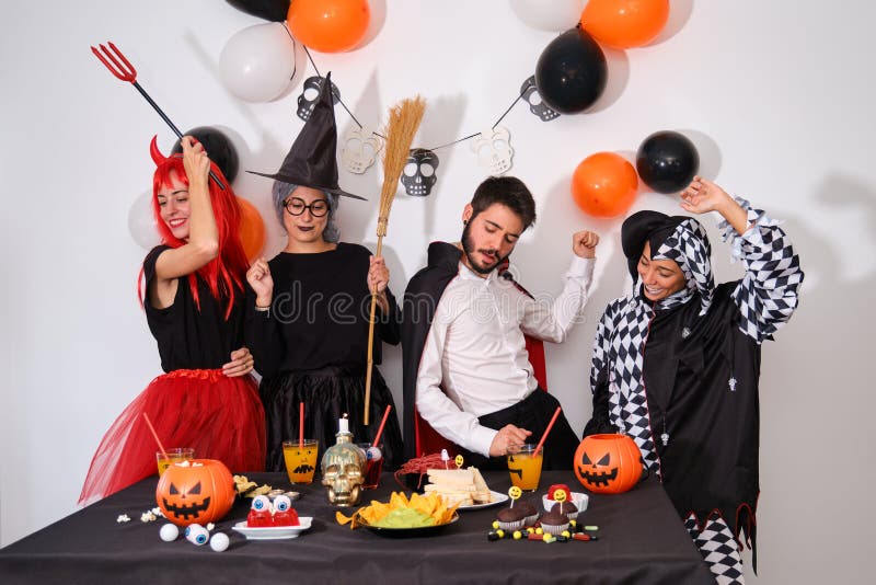 Four People Dancing at a Costume Halloween Party. Stock Photo - Image ...