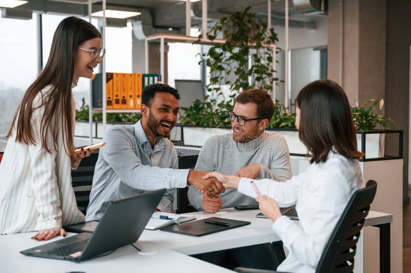 Four People are Working in the Office Together Stock Image - Image of ...