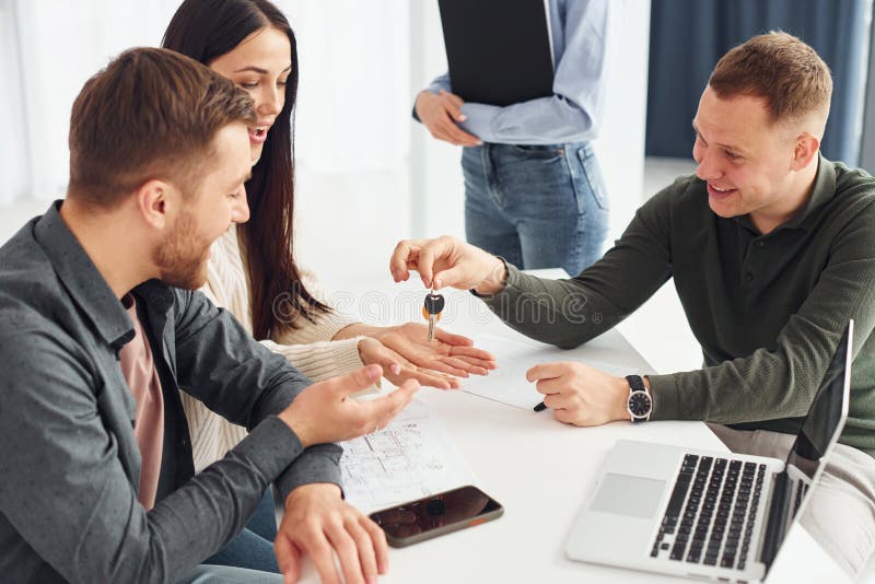 Four People Works in the Office by Sitting by the Table Indoors Stock ...