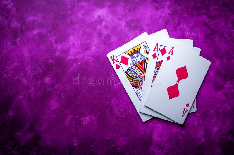 Four Playing Cards on Purple Suede Background Displaying Two Aces and ...