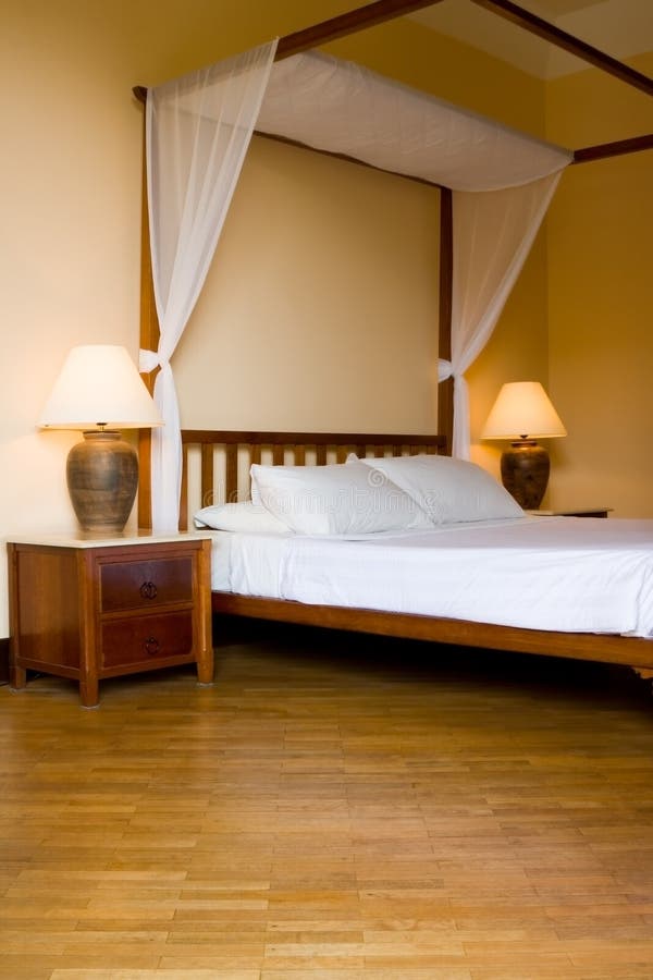 Four poster bed stock image. Image of pillow, column, vacation - 2589855