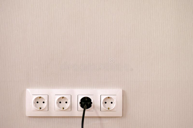 Four Power Sockets , Black Lead and Plug on the Wall Stock Image ...
