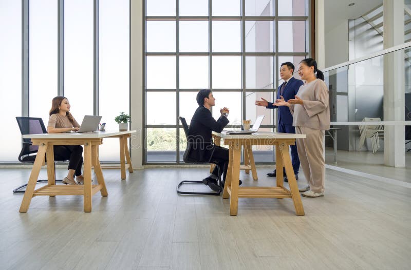 Group of Business People are Gathered in a Meeting Room, Discussing and ...