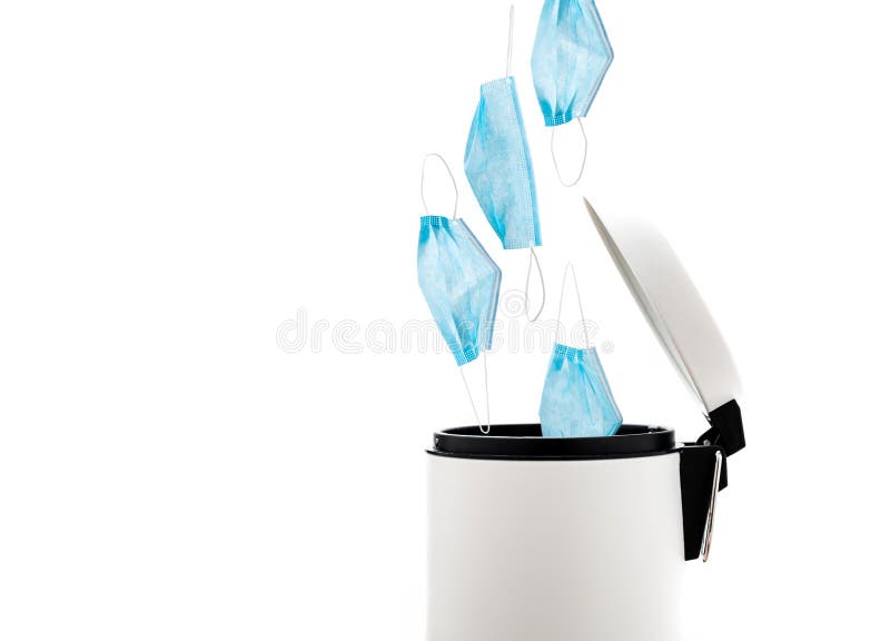Four Protective Face Masks Going To the Garbage Stock Image - Image of ...