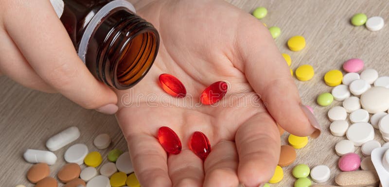Four Red Capsules in a Female Palm. Tablets in a Hand Close-up Stock ...