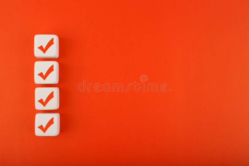 Checkmarks on Four Light Toy Blocks Against White Background with Copy ...